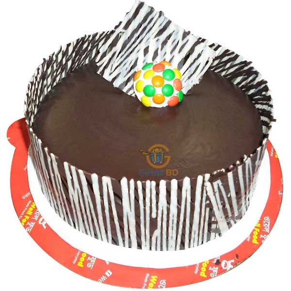 Chocolate round cake with candy ball - Well Food cake delivery service ...